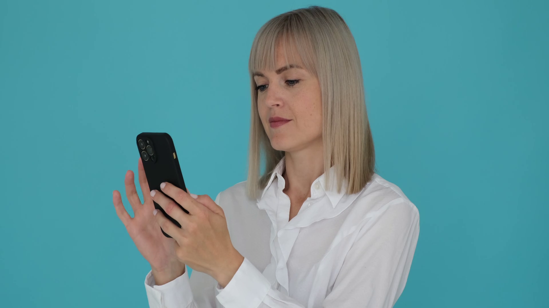 Smiling Woman Texting On Phone On Blue Stock Footage SBV-348483305 ...