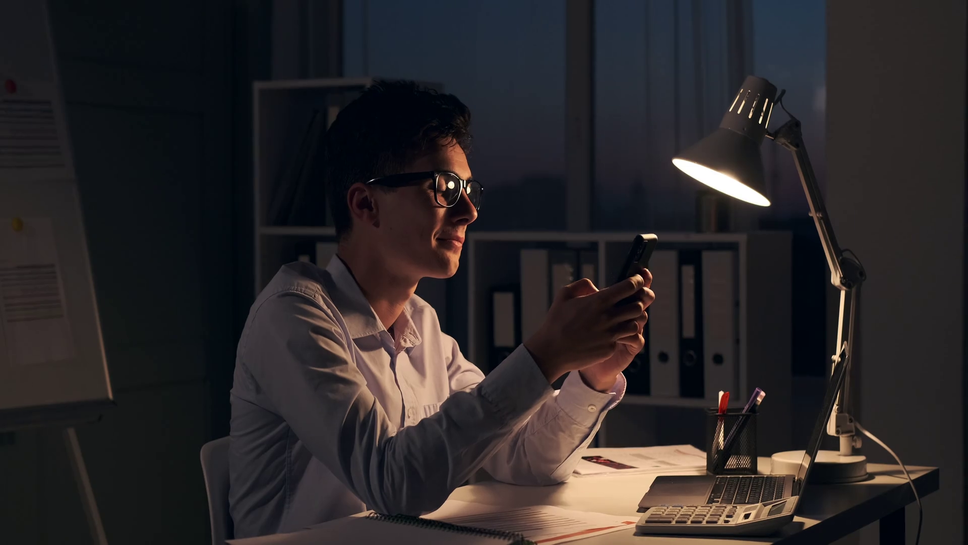 Cheerful Office Worker Browsing Phone At Desk Stock Footage SBV ...