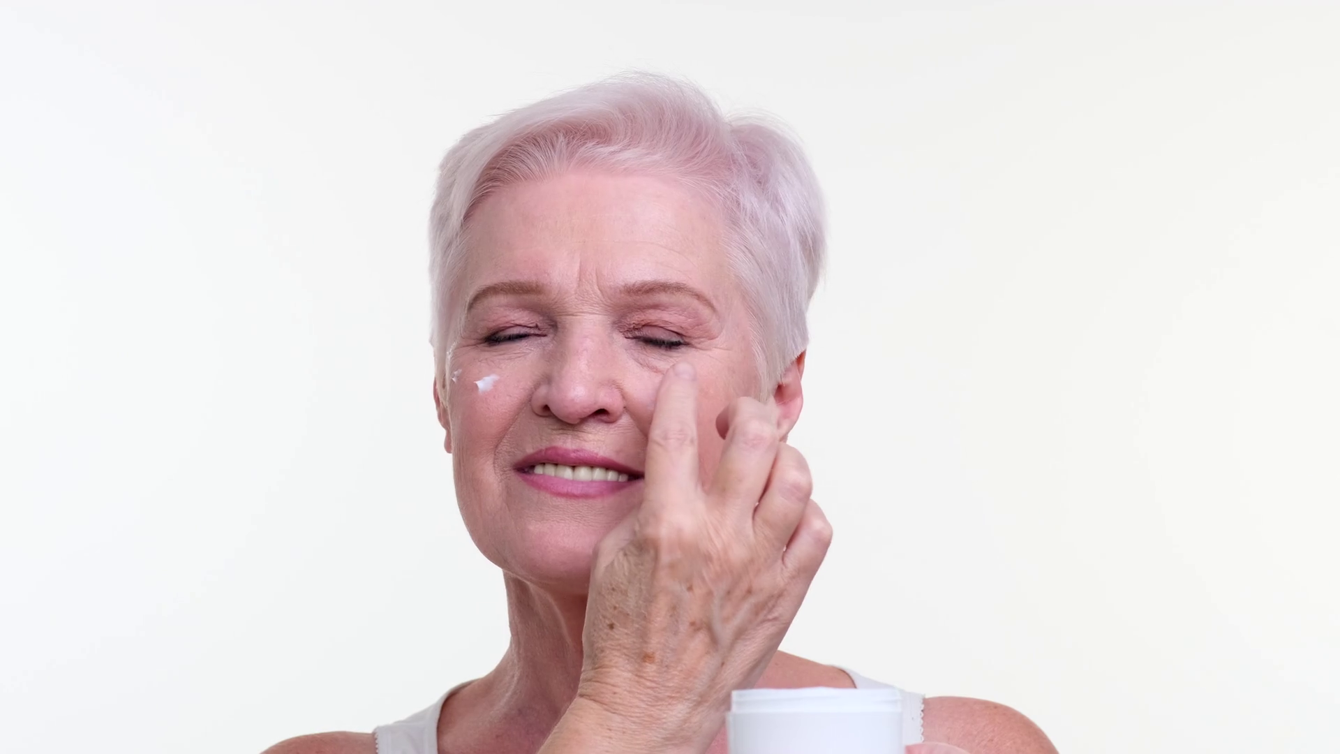 Old Woman Applying Face Cream Smiling On Stock Footage SBV-348622027 ...