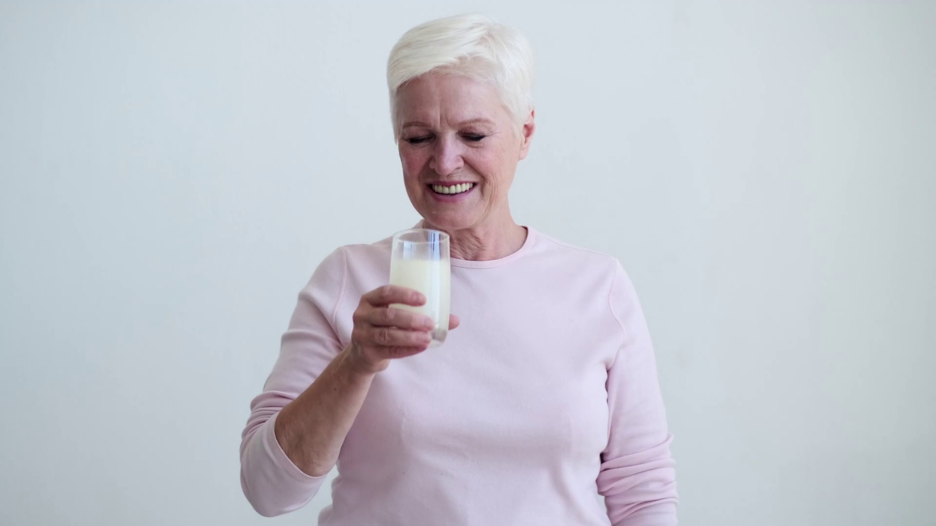 Senior Caucasian Woman Taking Sip Of Milk Stock Footage SBV-348769130 ...