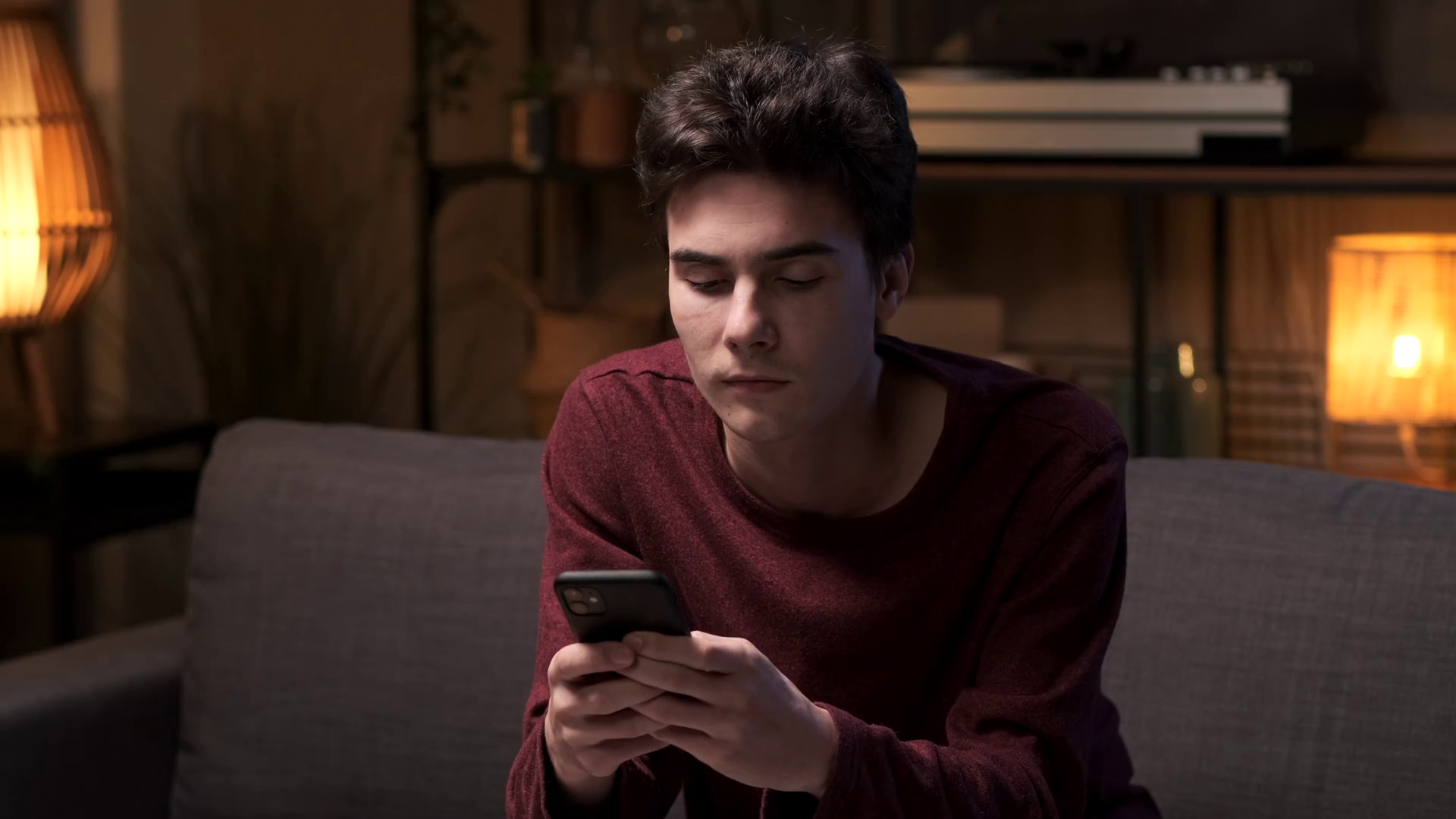Man Texting On Phone Sitting On Sofa In Stock Footage SBV-348769395 ...