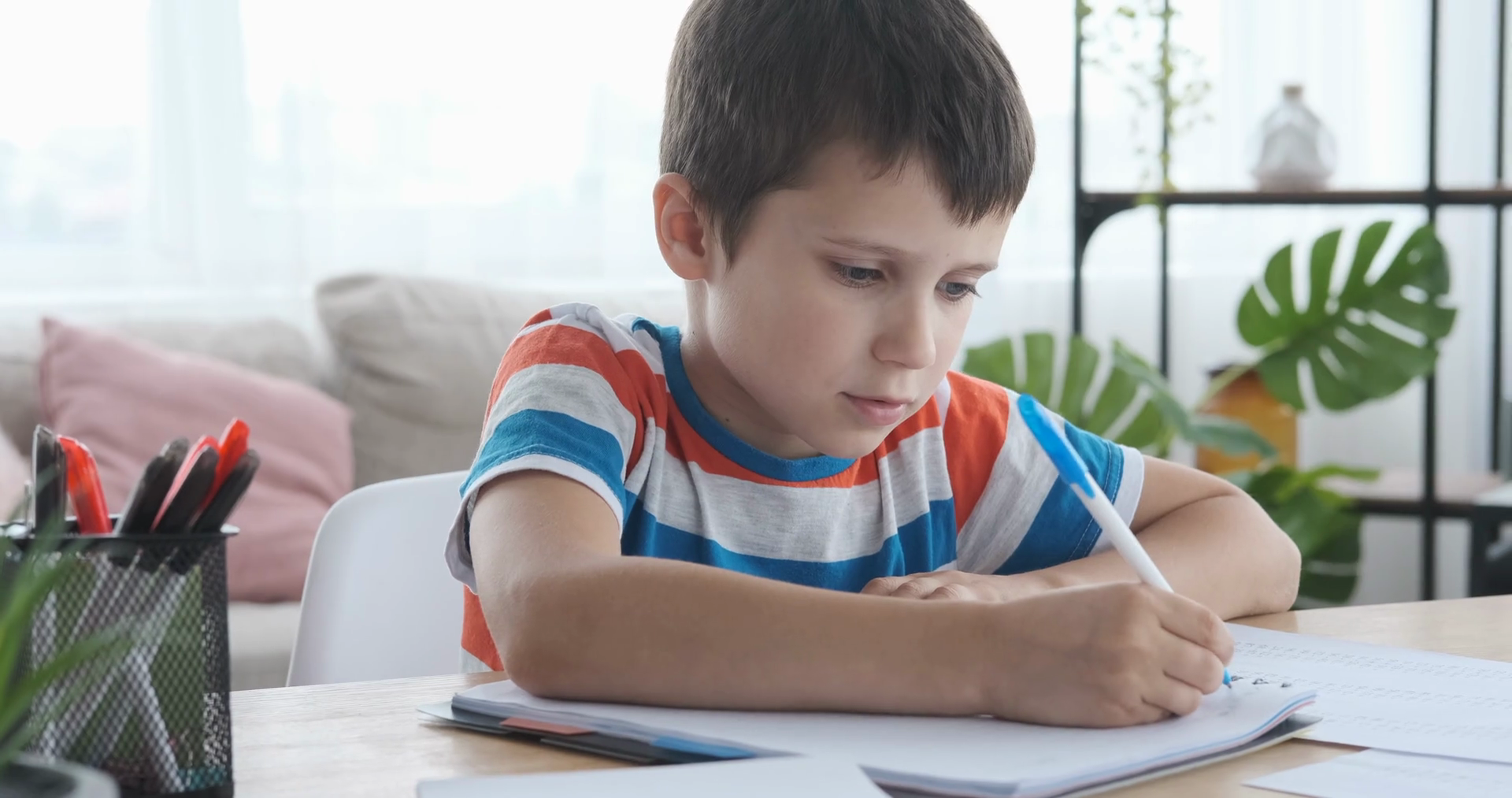 Boy doing homework in notebook Stock Video Footage 00:19 SBV-335496322 ...