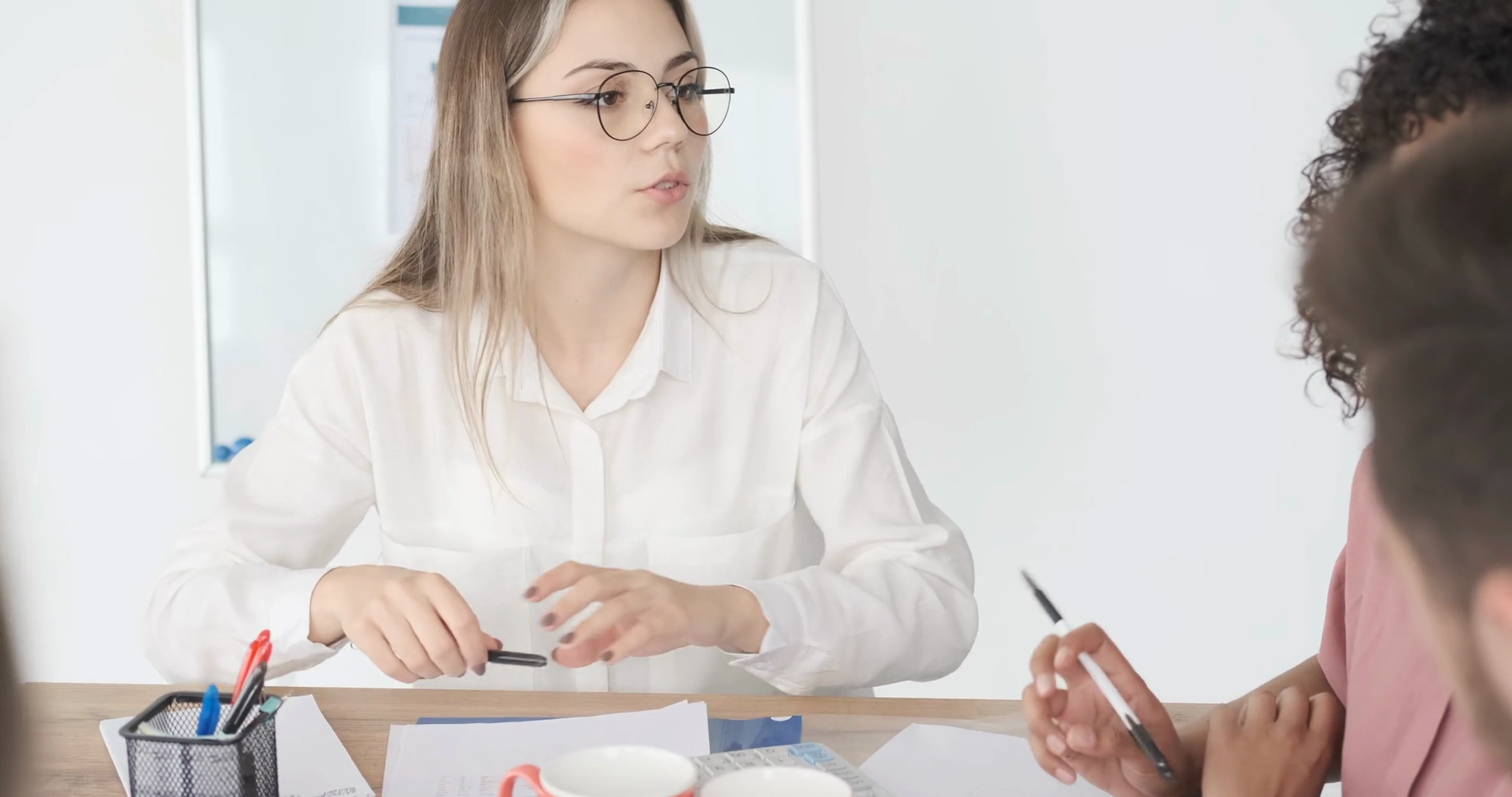 Business Team Writing Notes At Office Desk Stock Footage SBV-335472976 ...