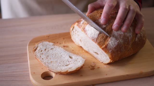 Cutting Bread Stock Footage: Royalty-Free Video Clips - Storyblocks