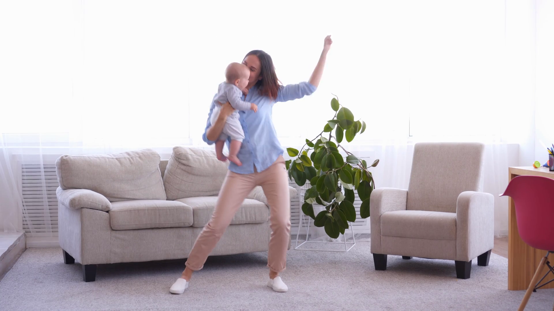 Cool mother dancing with baby girl in living room Stock Video Footage ...