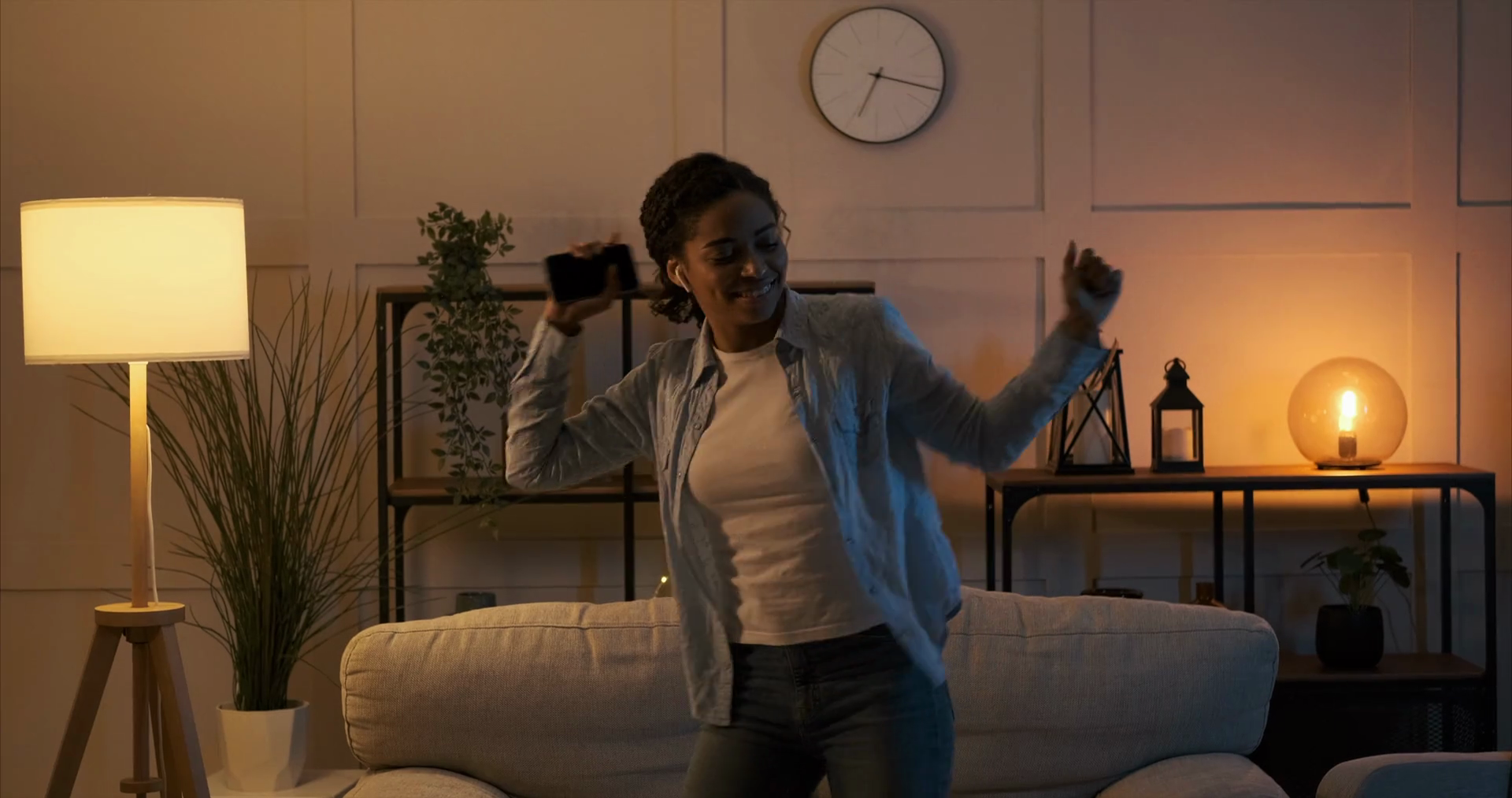 Woman holding mobile phone and dancing at night Stock Video Footage 00: ...