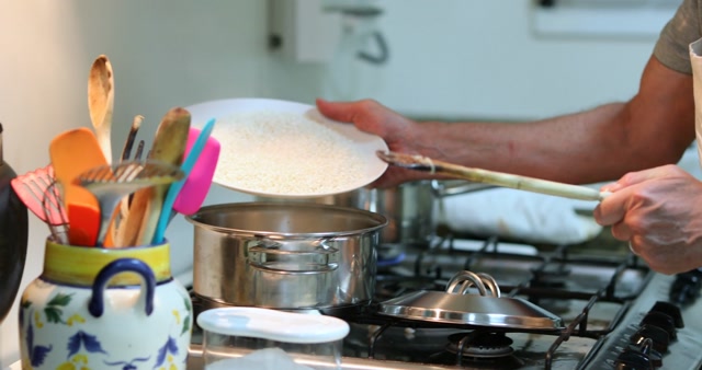 Man Cooking Rice Stock Footage: Royalty-Free Video Clips - Storyblocks