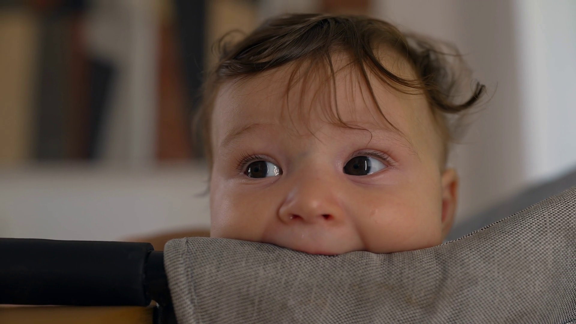 Baby Nibbling On High Chair Fabric Wide-eyed Stock Footage SBV ...