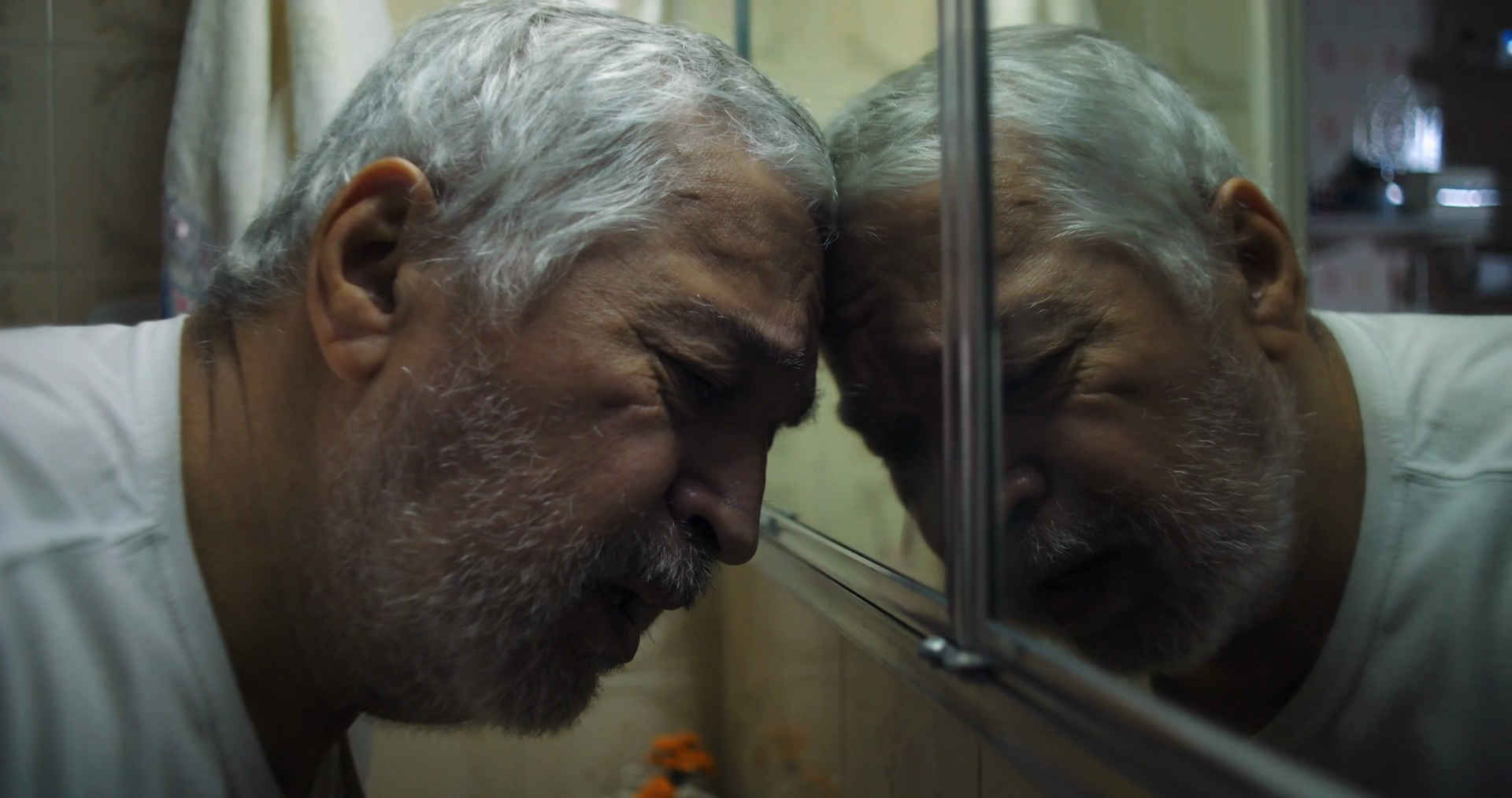 Older Man Resting Forehead Against Mirror Stock Footage SBV-353048662 ...
