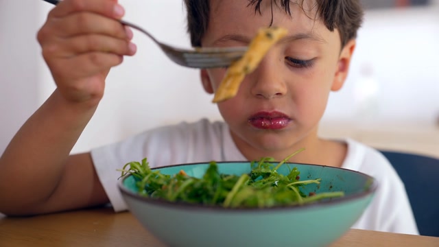 Child Chewing Food Stock Footage: Royalty-Free Video Clips - Storyblocks
