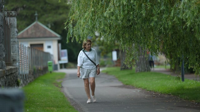 Woman Walking From Behind College Campus Stock Footage: Royalty-Free ...