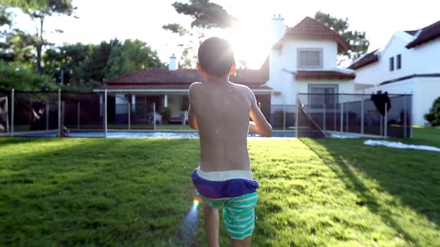 Young Boy Walking Out Of Pool Stock Footage: Royalty-Free Video Clips ...