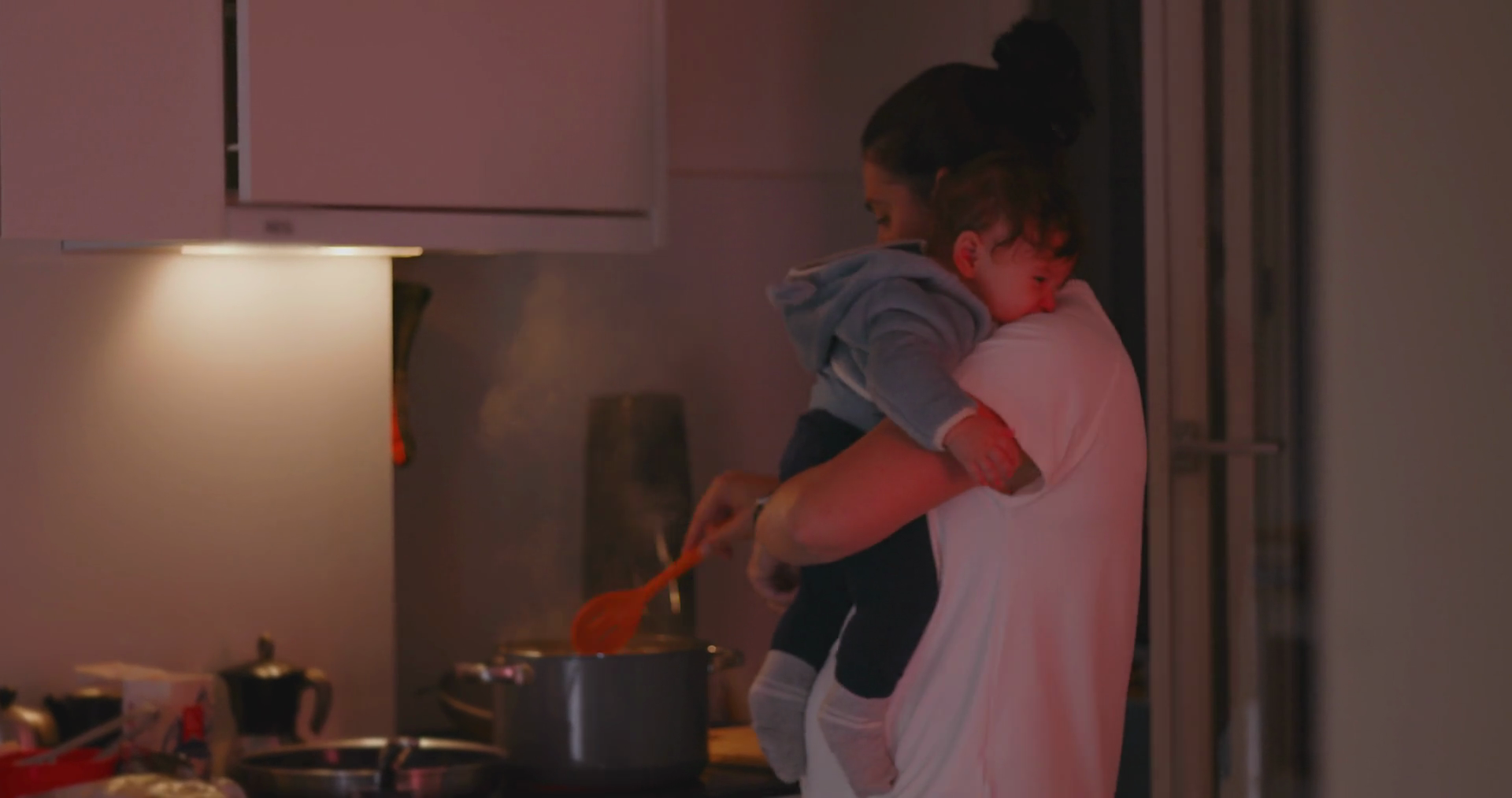 Mother Stirring Pot Holding Baby In Arms Stock Footage SBV-353148577 ...