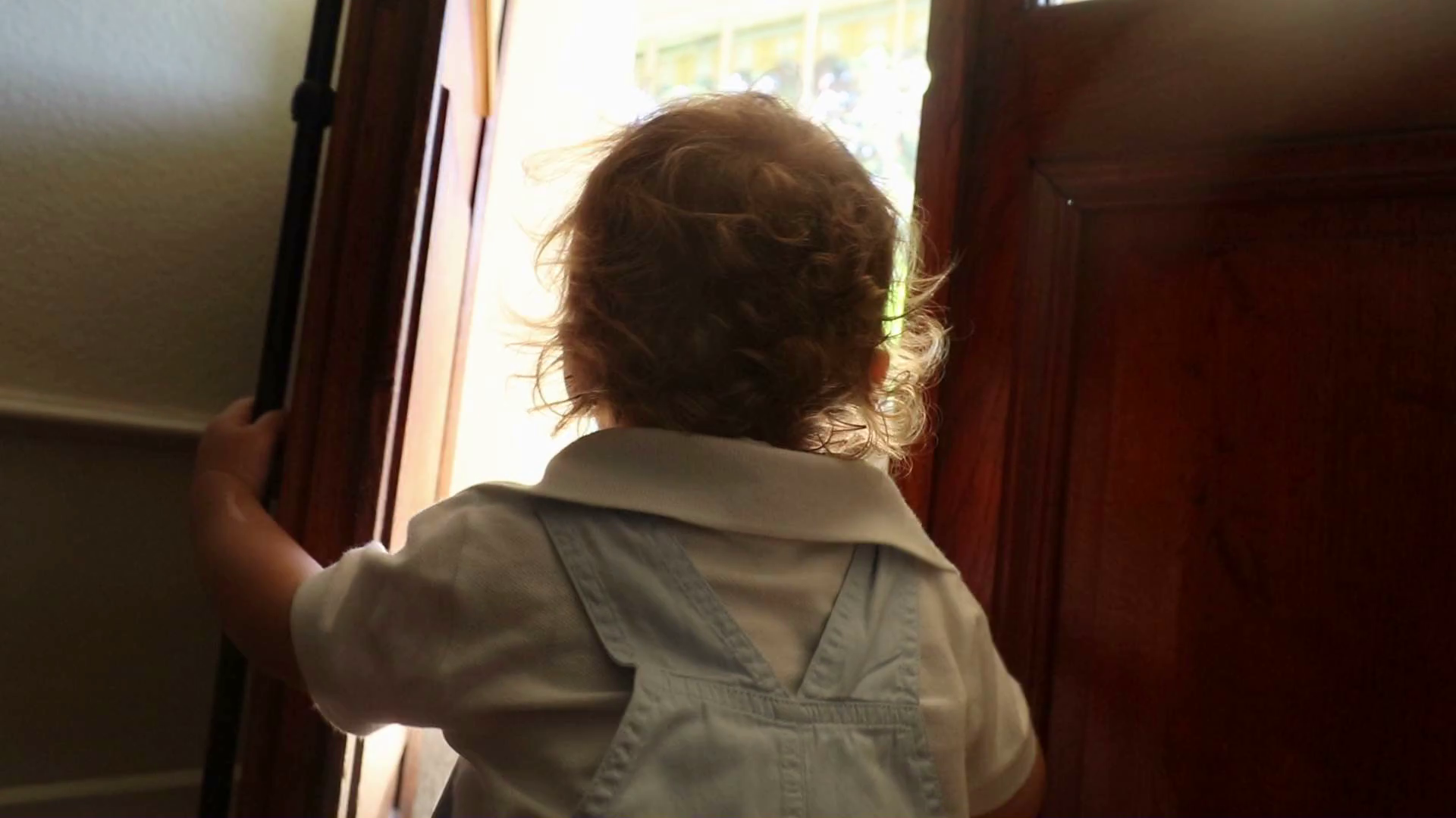 Curious Entrance: Adorable Toddler Opening Stock Footage SBV-348439123 ...