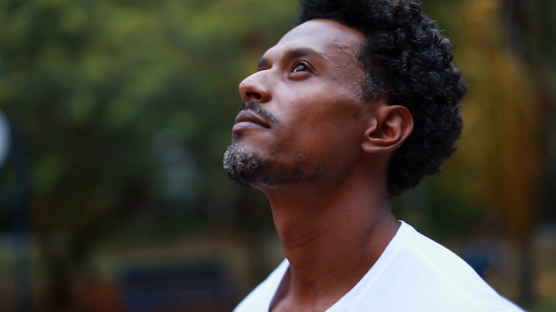 African Man Outdoors Gazing Skyward With Stock Footage SBV-348470380 ...