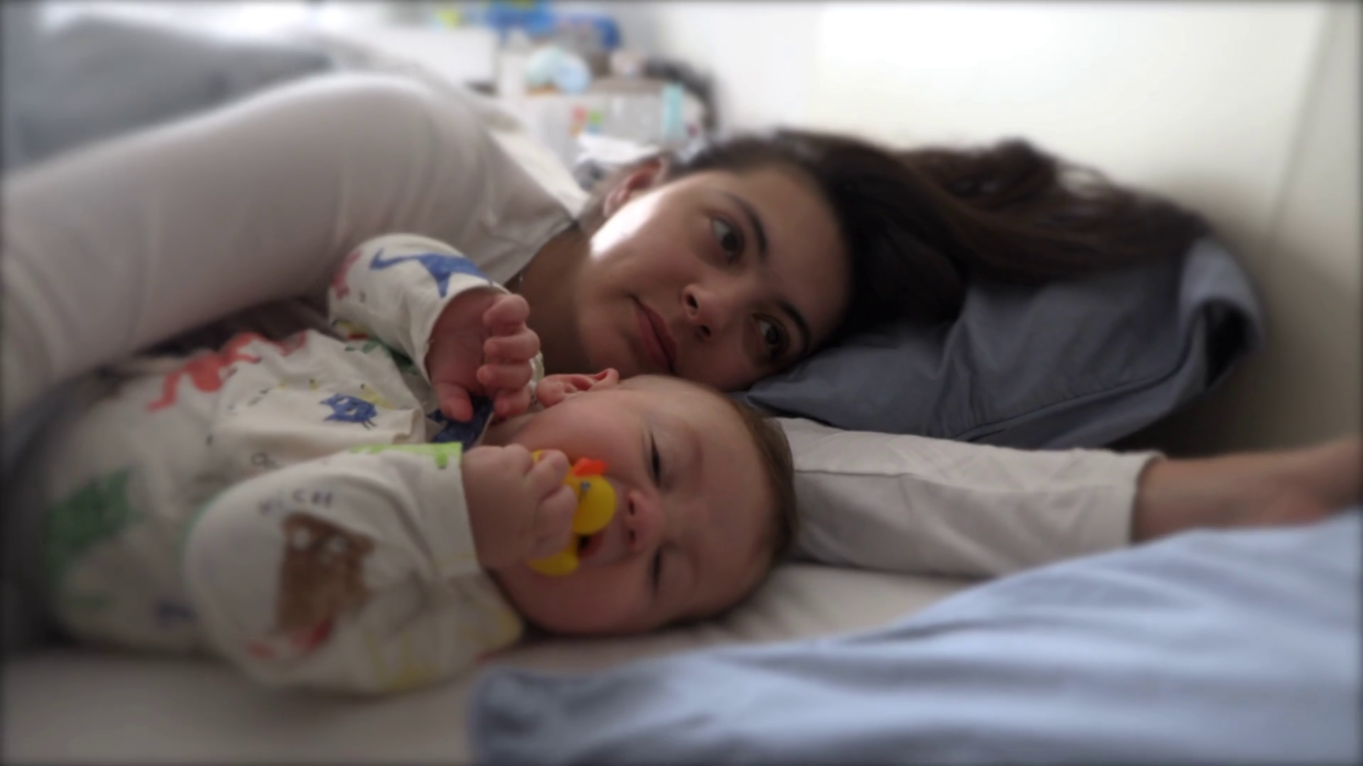 Cozy Bedtime Bonding: Parent Baby Snuggle Stock Footage SBV-348413348 - Storyblocks