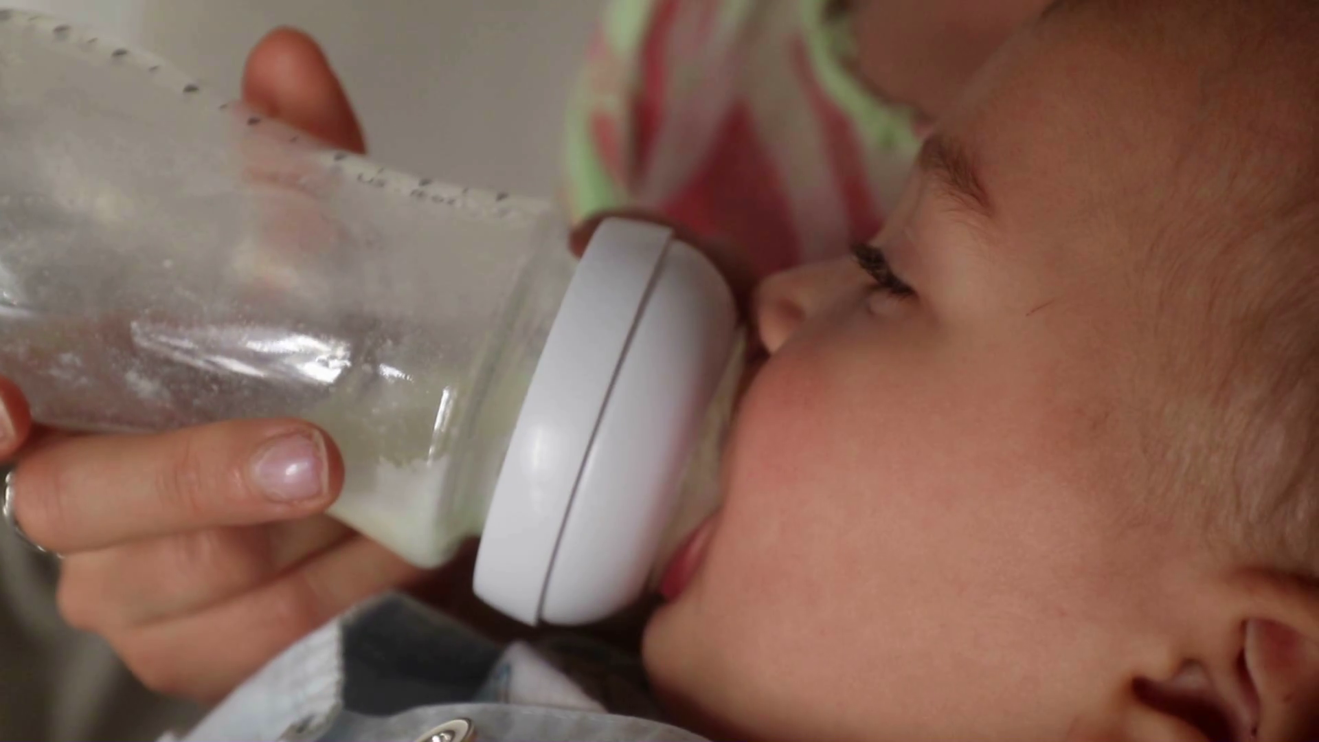 Nourishing Moment: Baby Sipping Milk From Stock Footage SBV-348438341 ...