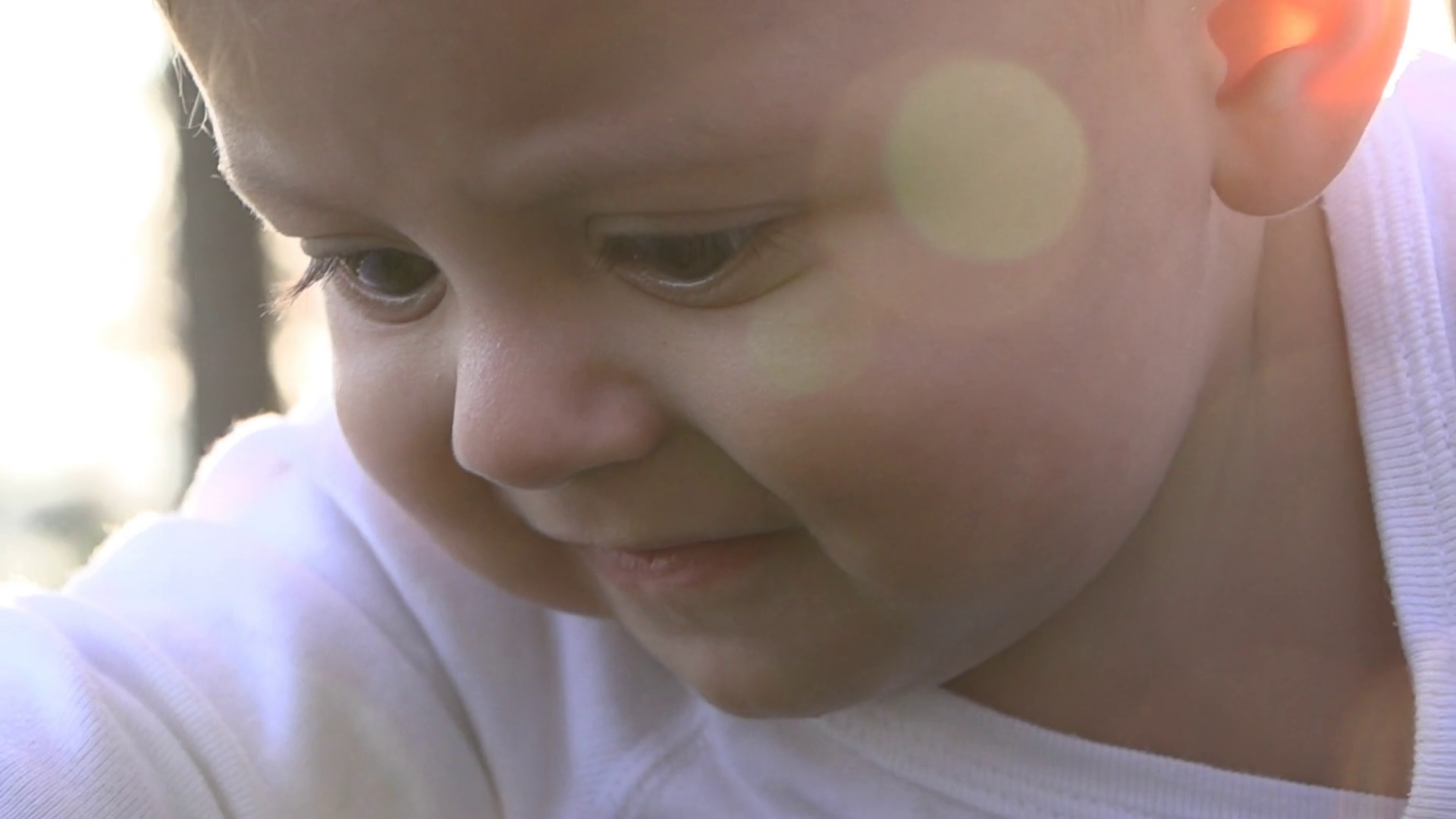 Sunlit Baby Delight: Infant Boy Outdoors Stock Footage SBV-348422772 ...