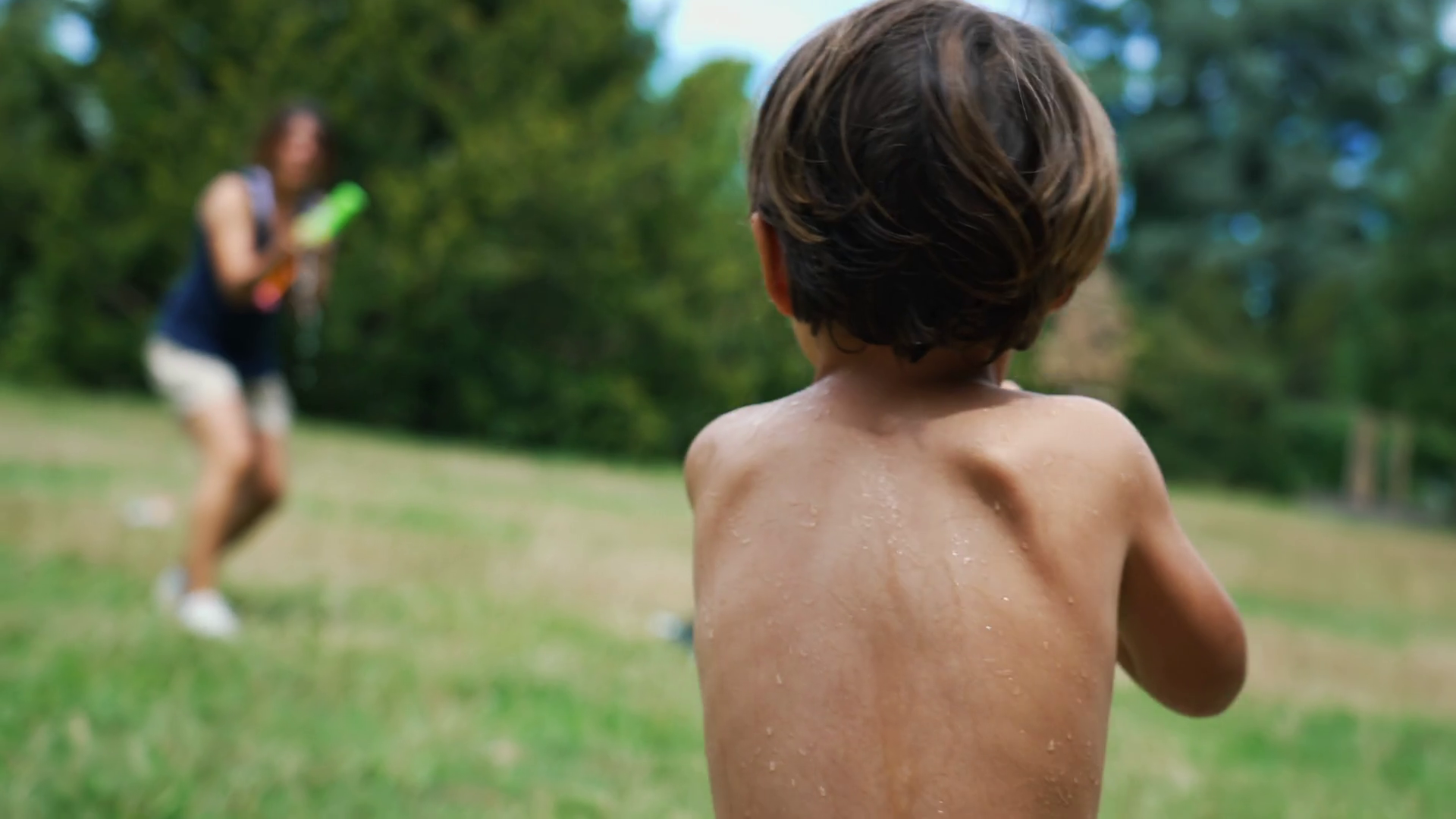 Back Of Child Playing With Water Toy Fun Kid Stock Footage SBV ...