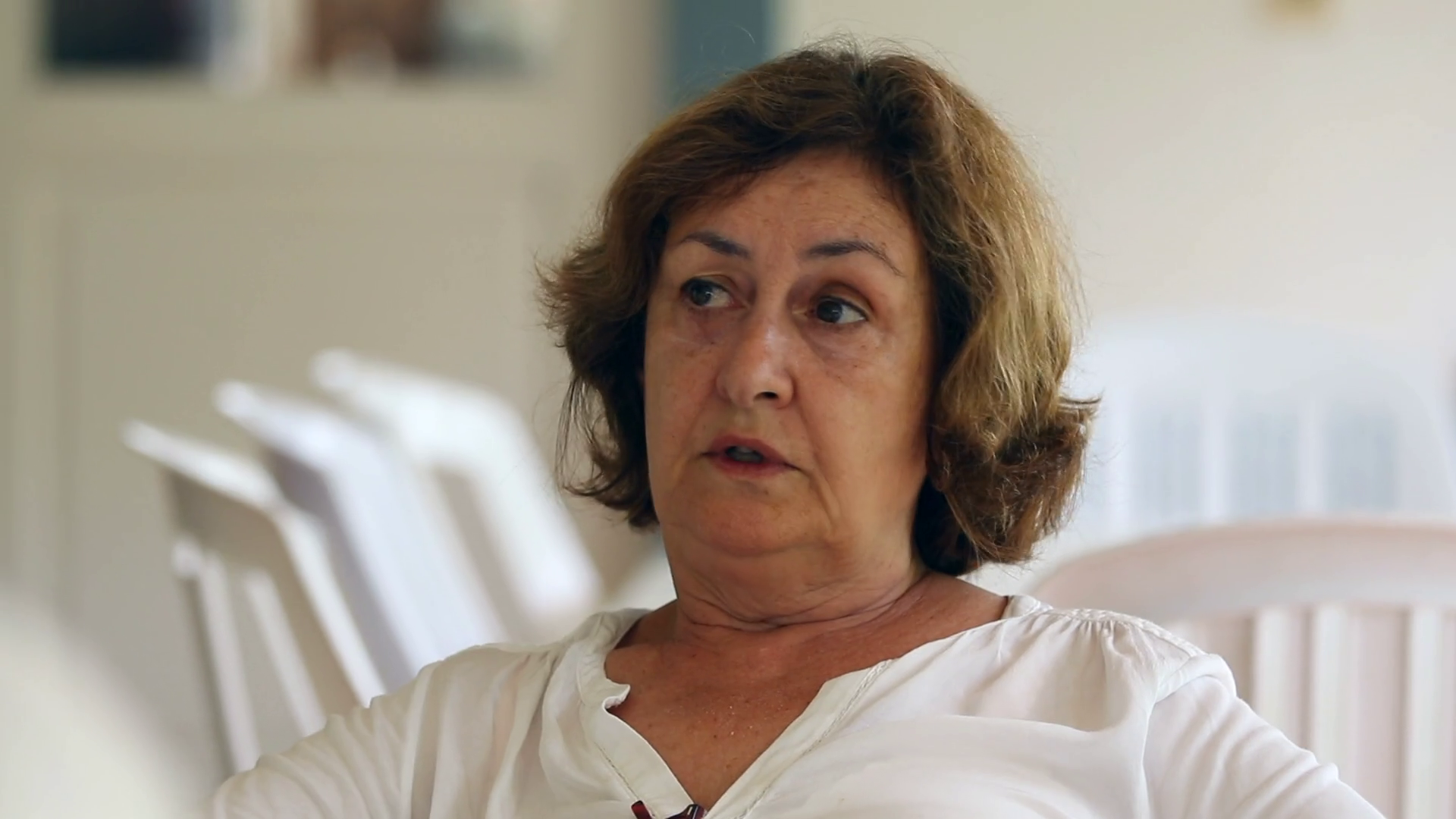 Genuine Conversation: Elderly Woman Engaged Stock Footage SBV-348411238 - Storyblocks