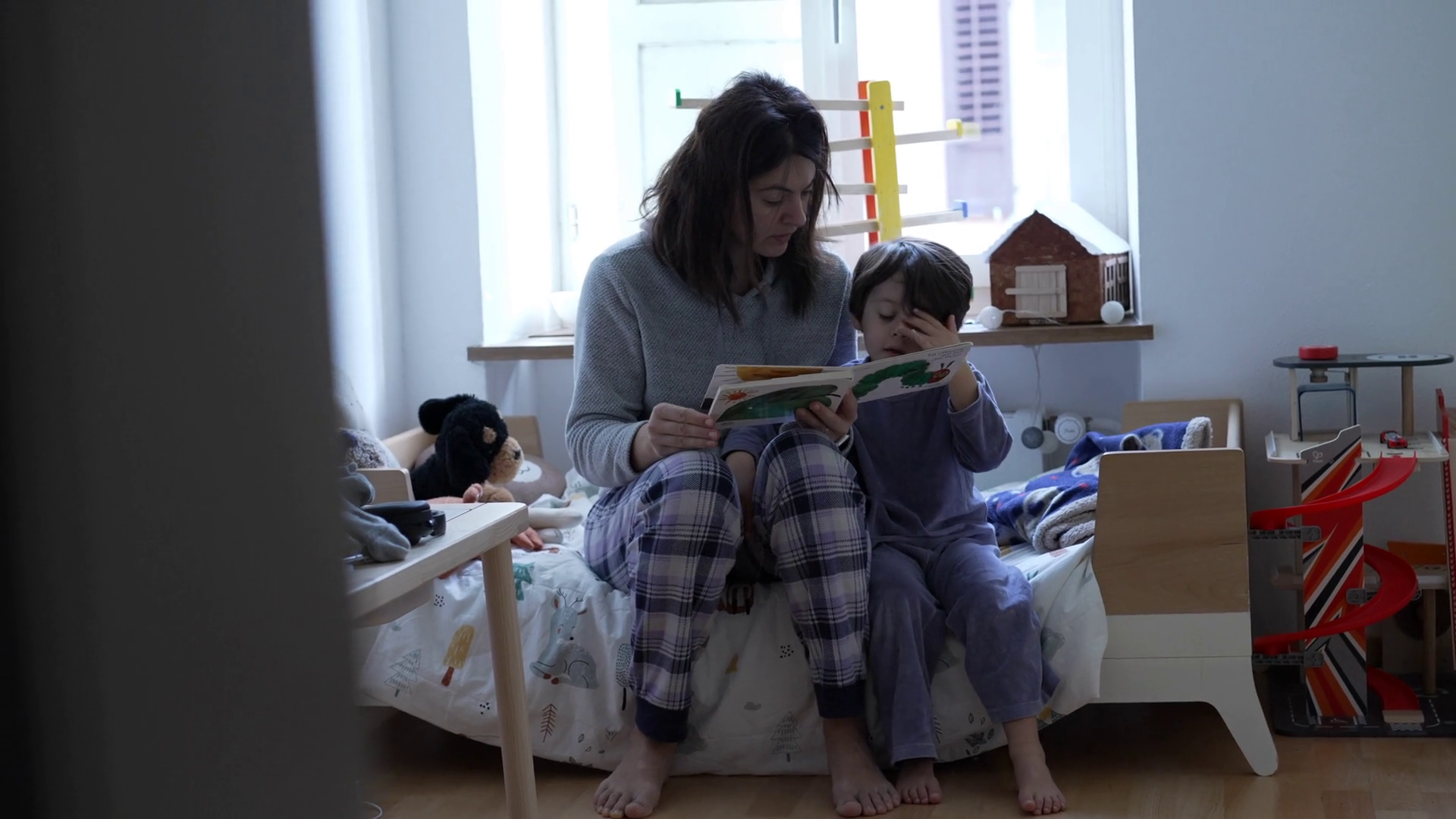 Bedtime Bonding: Authentic Mother Shares Stock Footage SBV-348396640 - Storyblocks