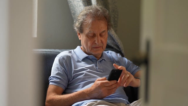 Man Watching Smartphone Stock Footage: Royalty-Free Video Clips ...