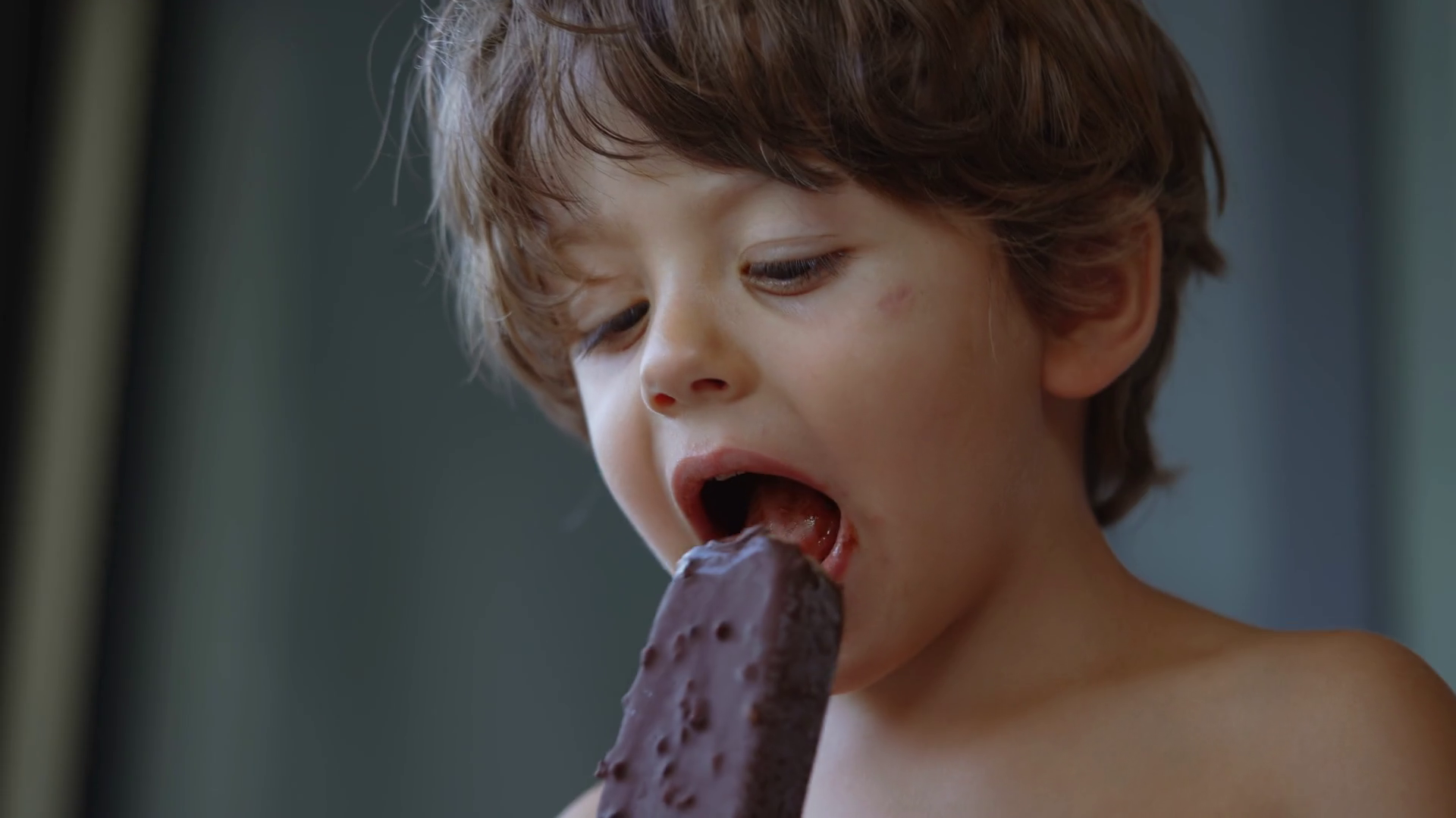 Close Up View Of Little Boy Taking Bite Of Stock Footage SBV-348864689 ...