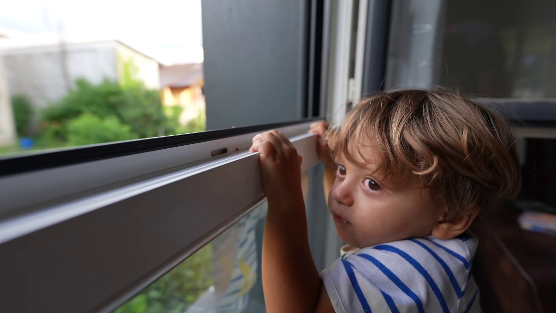 Child Holding Into Window Dangerous Little Stock Footage SBV-348705755 ...