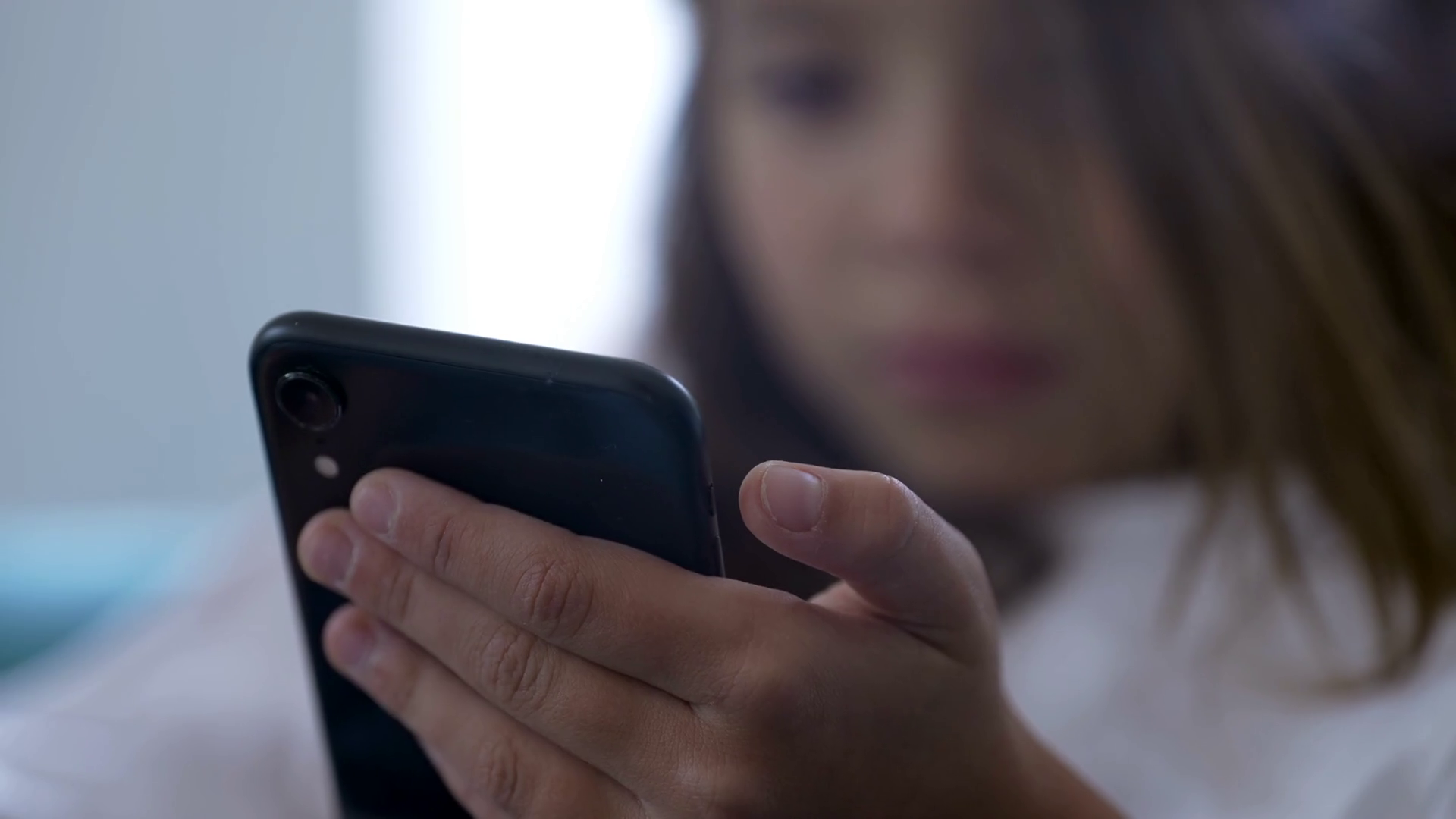Child Holding Phone Staring At Screen Stock Footage SBV-348792711 ...