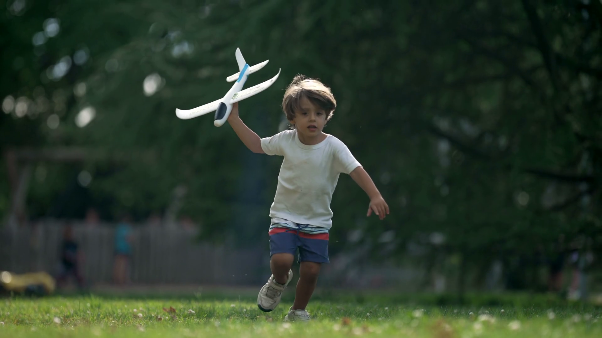 Child Playing With Toy Glider Plane In Park Stock Footage SBV-348864957 ...
