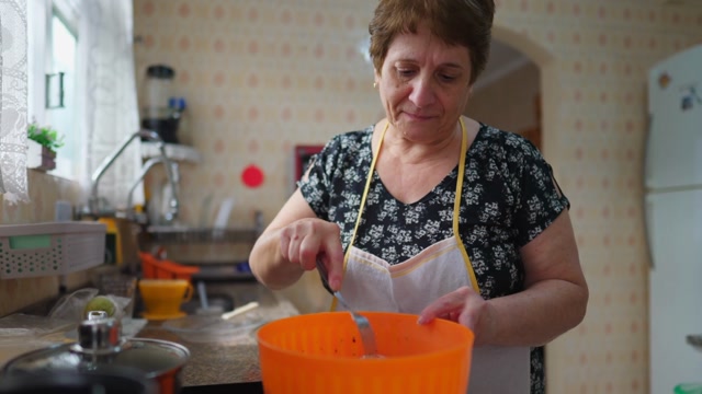 Mature Woman Cooking Stock Footage: Royalty-Free Video Clips - Storyblocks