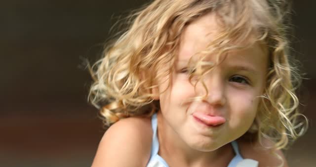 Little Girl Tongue Out Stock Footage: Royalty-Free Video Clips - Storyblocks