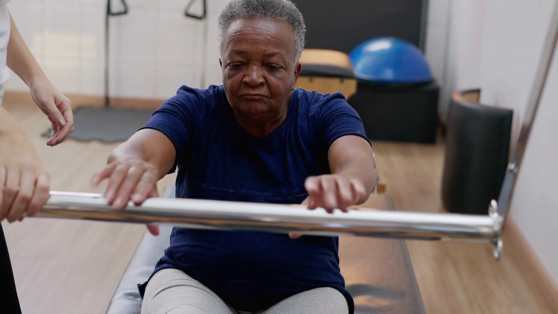 Female Pilates Coach Assisting Black Senior Stock Footage SBV-348509057 ...