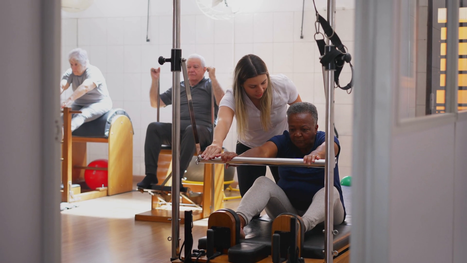 Female Pilates Coach Assisting Senior Black Stock Footage SBV-348509062 ...