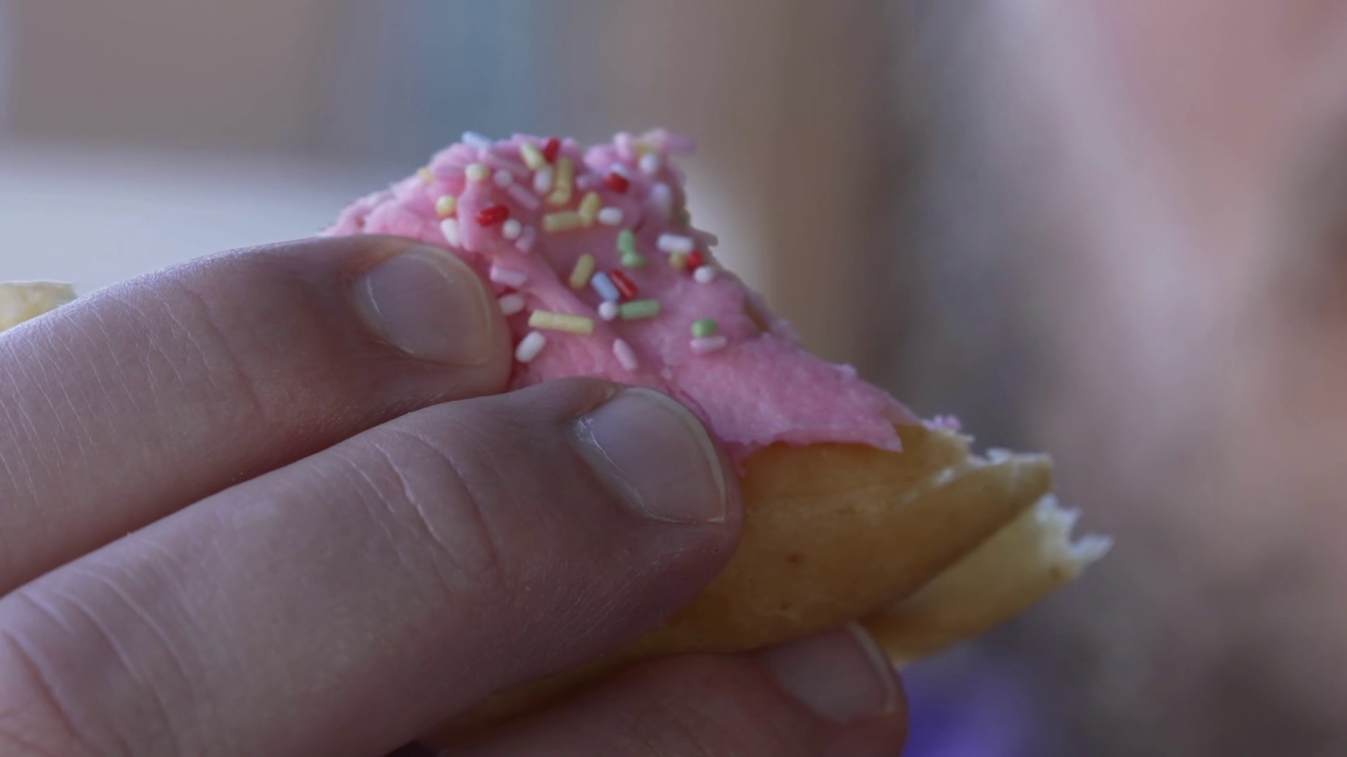 Indulgent Bite: Hand Gripping Half-eaten Stock Footage SBV-348436289 ...