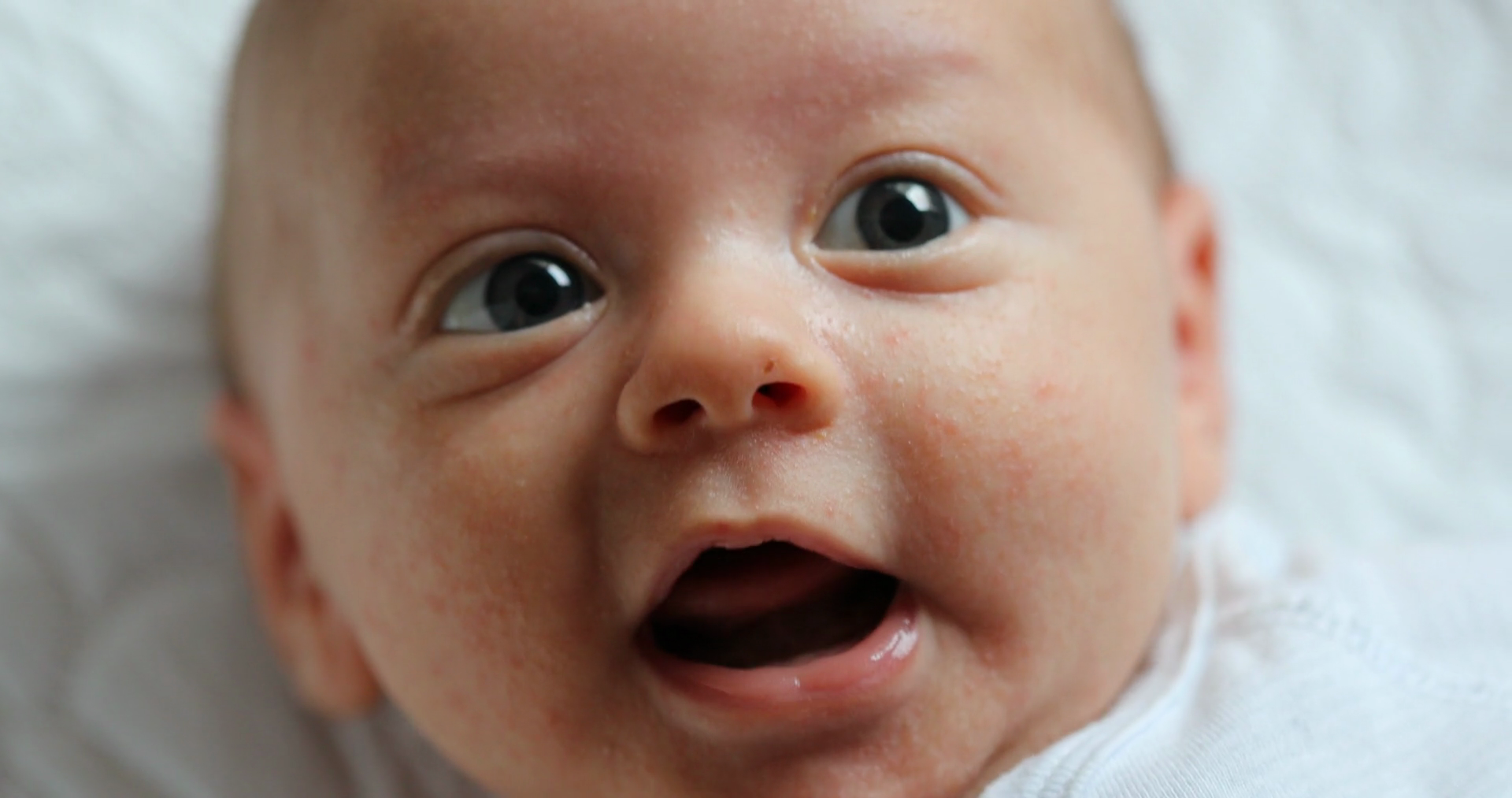 Pure Joy: Newborn's Expressive Smiling Face Stock Footage SBV-348433279 - Storyblocks