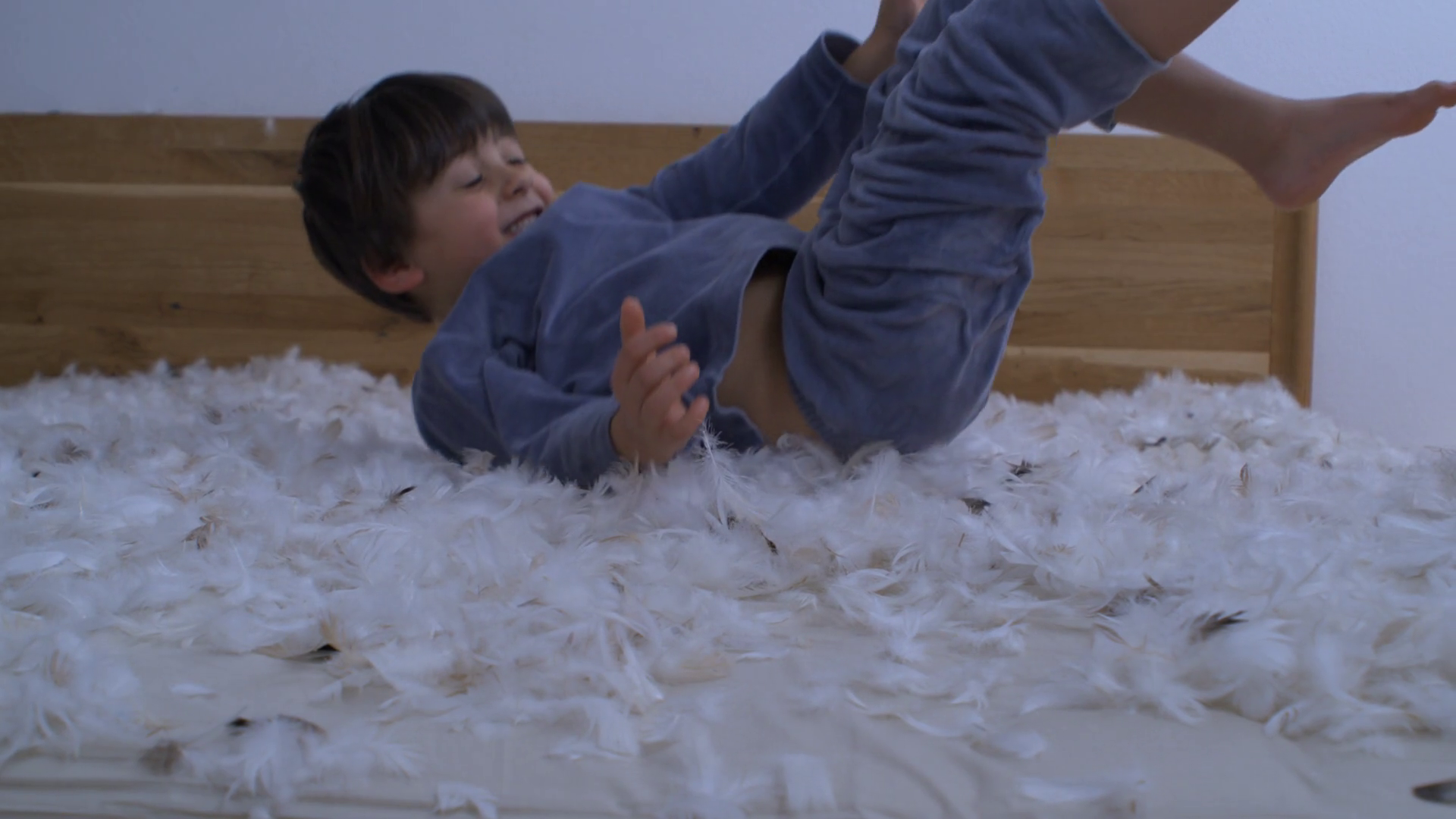 Happy Child Falling Into Bed Surface Covered Stock Footage SBV ...