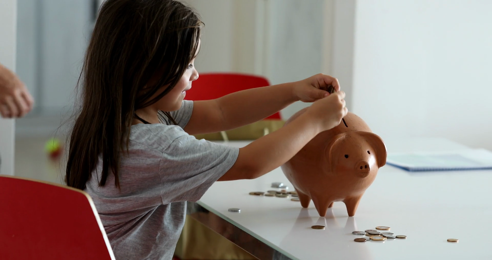 Little Girl Adding Coins Inside Piggy Bank Stock Footage SBV-348827329 ...