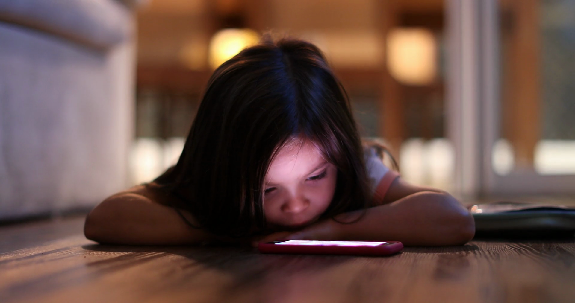 Little Girl Staring At Cellphone Screen At Stock Footage SBV-348536794 ...