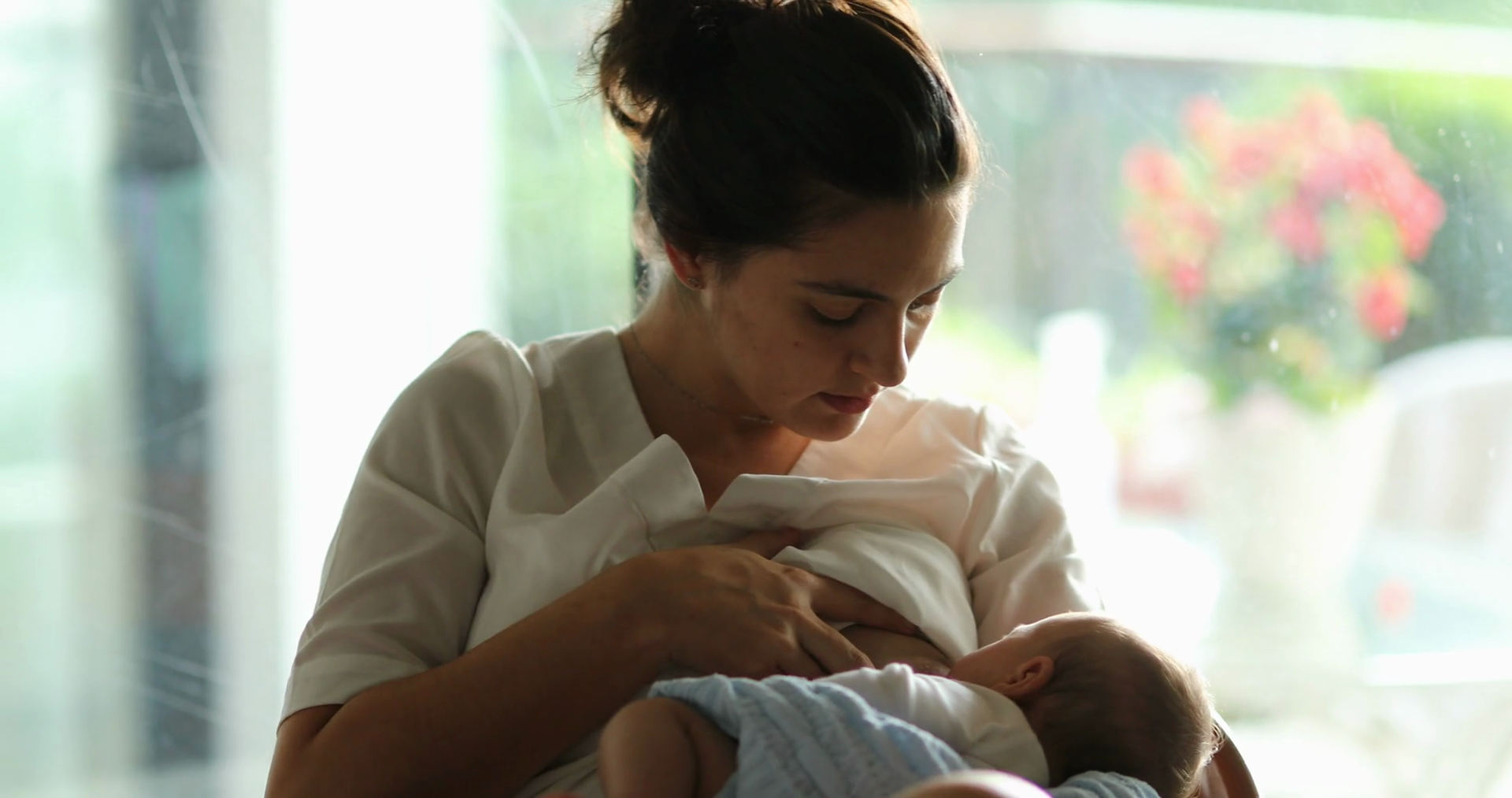 Nurturing Bond: Mother Breastfeeding Newborn Stock Footage SBV-348433392 - Storyblocks