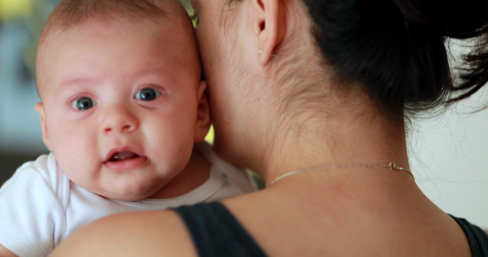 Calming Embrace: Mother Holds Crying Baby Stock Footage SBV-348426014 - Storyblocks