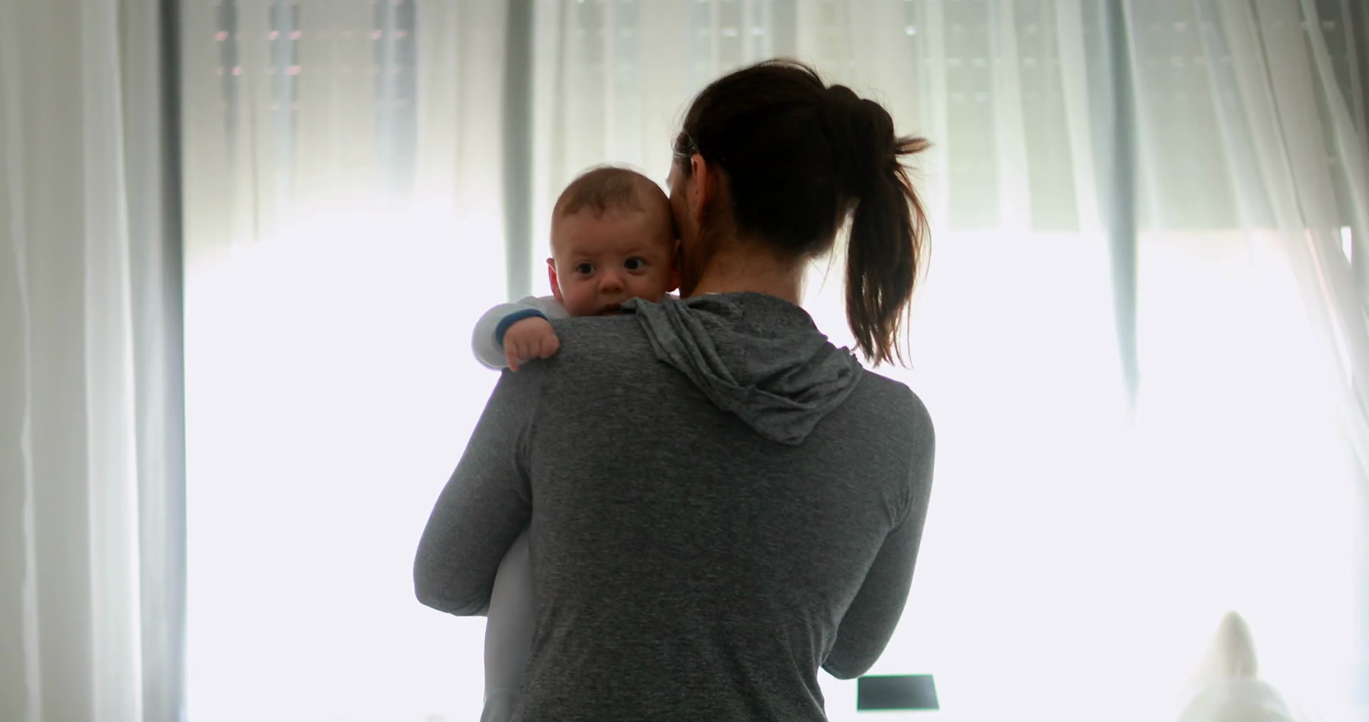 Comforting Embrace: Mother Holding Soothing Stock Footage SBV-348426012 - Storyblocks