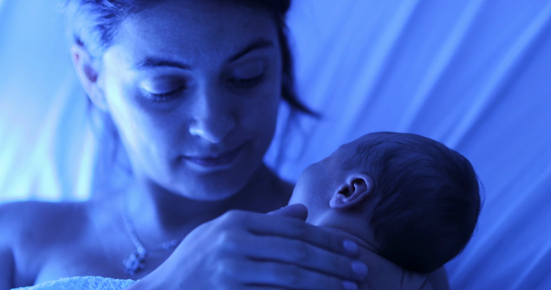 Nurturing Glow: Mother Holding Newborn Baby Stock Footage SBV-348432055 ...