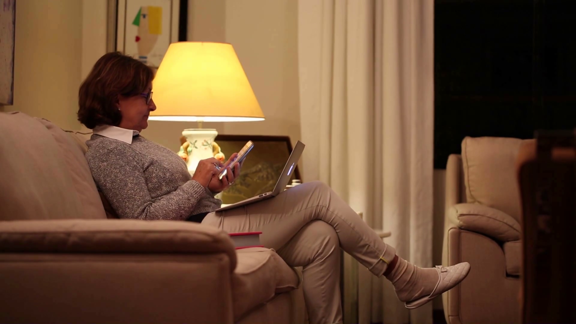 Multitasking With Ease: Older Woman In 60s Stock Footage SBV-348439644 ...