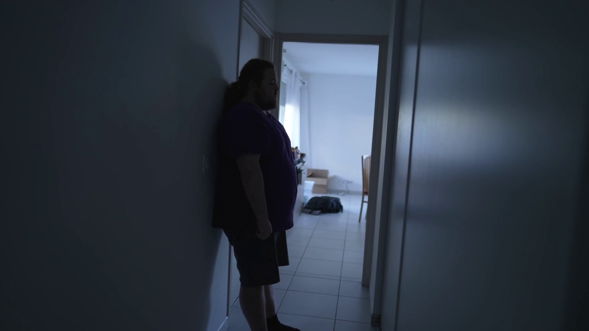 Corridor Of Gloom: Overweight Man Struggling Stock Footage SBV ...