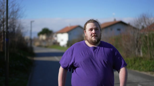 Fat Man Walking Stock Footage: Royalty-Free Video Clips - Storyblocks