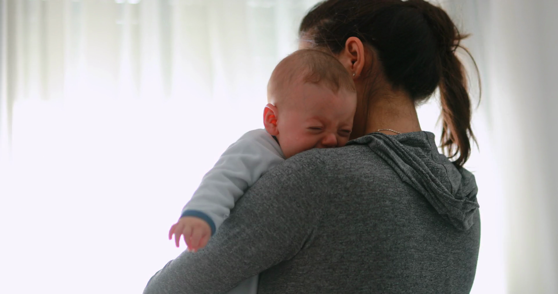 Embracing Comfort: Mother Soothes Crying Stock Footage SBV-348426137 - Storyblocks