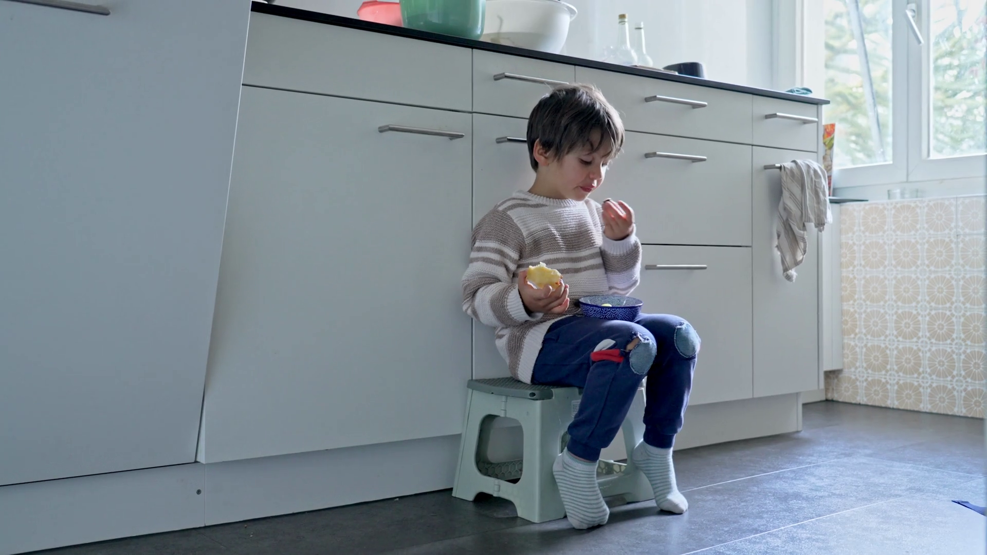 Seated On Kitchen Stool Little Boy Serves Stock Footage SBV-348922363 ...