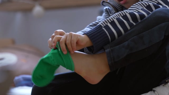 Boy Putting On Socks Stock Footage: Royalty-Free Video Clips - Storyblocks