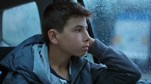 Person Staring Out Window Thinking Stock Footage: Royalty-Free Video ...